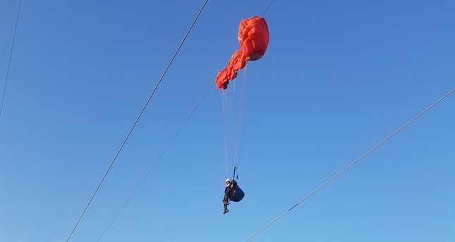 Paraglider hangs from powerline for 2 hours in southern Turkey - Daily ...