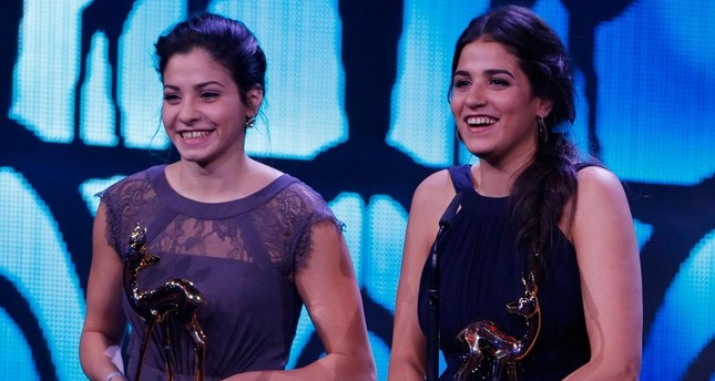 Syrian swimmer who towed sinking refugee boat to safety still detained ...